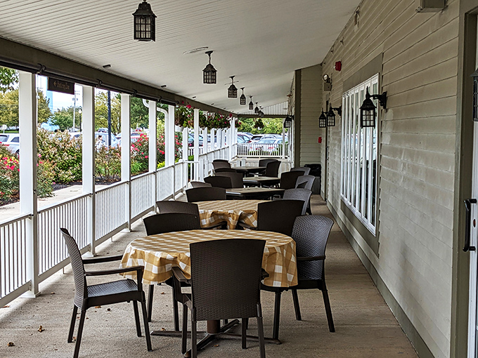 The wraparound porch offers al fresco dining with a side of people-watching. Those checkered tablecloths continue outdoors, proving good taste knows no boundaries.
