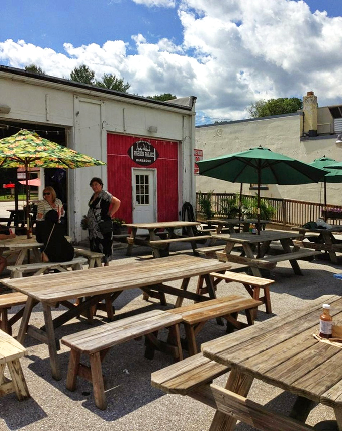 The outdoor seating area feels like a backyard cookout where everyone's invited. Those picnic tables have supported many happy elbows.