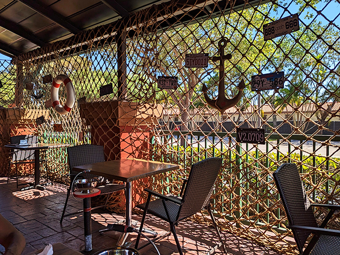 The outdoor patio's nautical netting isn't just decorative&mdash;it's preparing you mentally for the fishing expedition your fork is about to undertake.