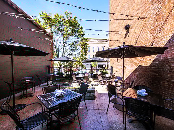 The outdoor patio where summer evenings stretch into night, string lights twinkling overhead like stars approving of your dinner choice.