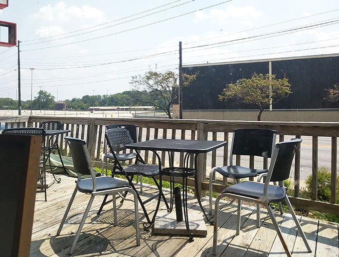 The modest patio offers fresh air with your fries. Sometimes the simplest settings create the most memorable meals.