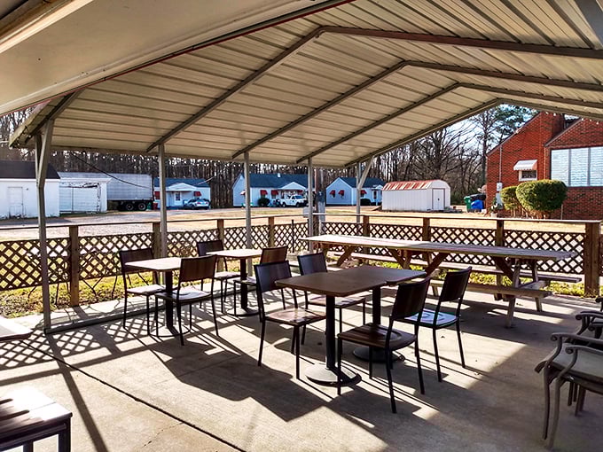 The covered patio offers al fresco dining without the fuss, where summer breezes complement the savory aromas wafting from inside.