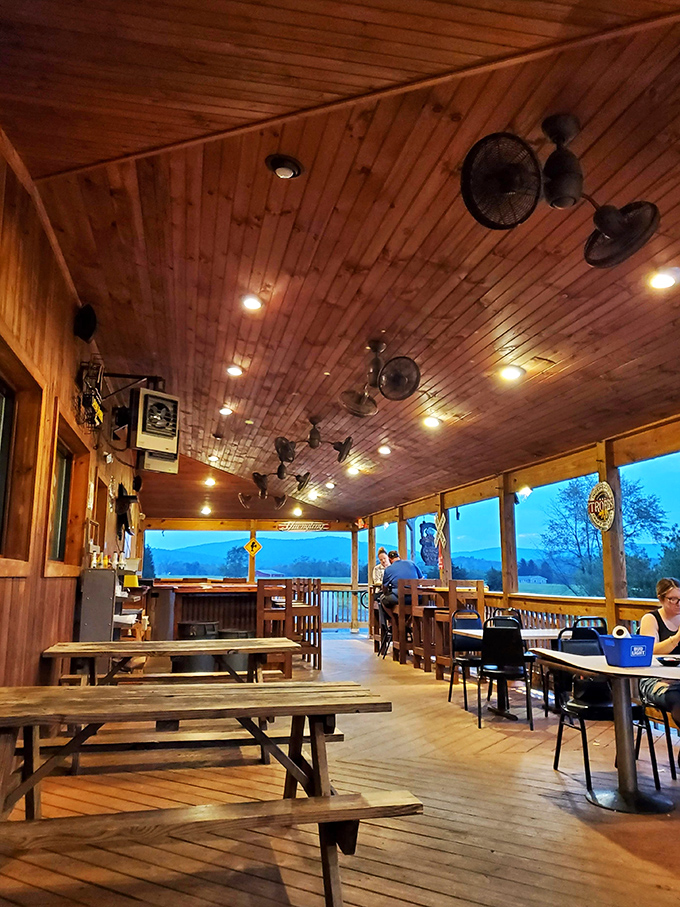 The covered porch offers mountain views that pair perfectly with seafood—nature's version of surf and turf.