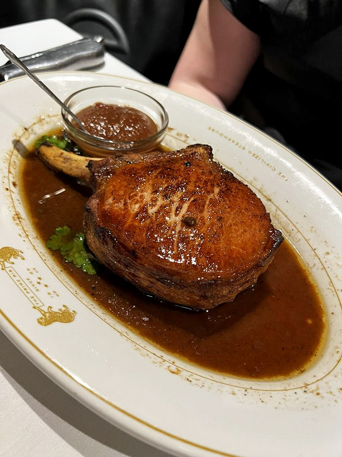 This isn't just a pork chop&mdash;it's a masterpiece of meat, swimming in savory jus that you'll be tempted to drink directly from the plate.