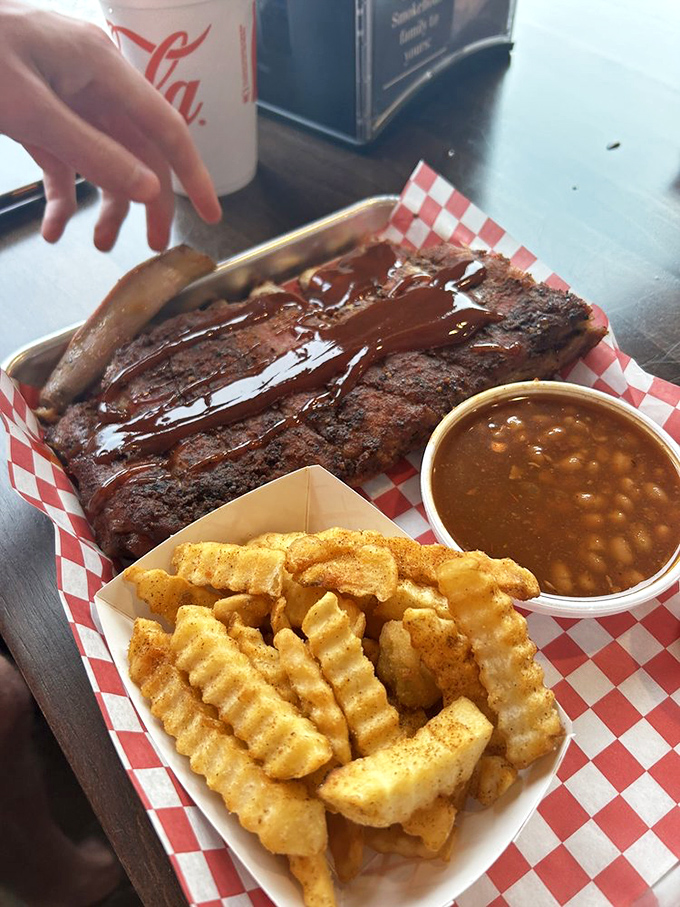 Ribs glazed with sauce that should be illegal in at least nine states, threatening to upstage even those perfectly seasoned fries.