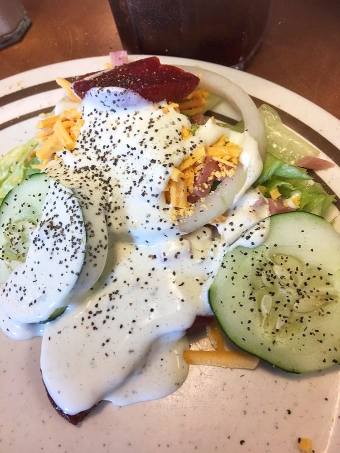 A garden-fresh salad drizzled with ranch and topped with shredded cheese &ndash; because at a Southern buffet, even the vegetables get dressed up.