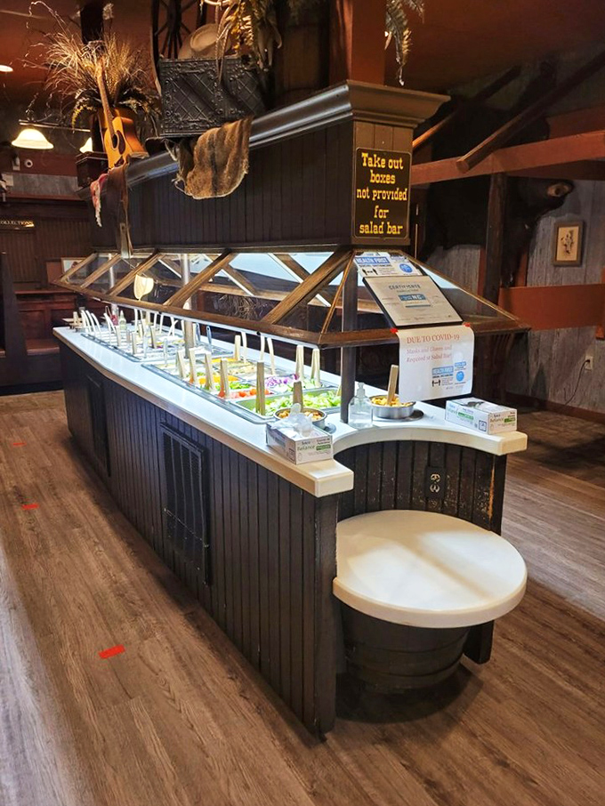 The salad bar stands ready for duty, a fresh prelude to the meaty main event. Consider it the opening act that deserves its own applause.