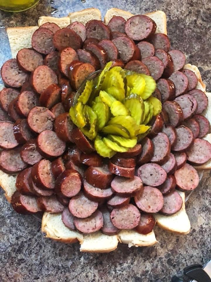Sausage arranged like a floral bouquet, if flowers were made of smoked meat and happiness. The pickle center is the chef's kiss.