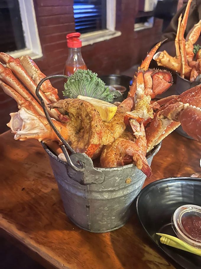 Metal bucket, magical contents - these crab legs aren't just food, they're an interactive experience that rewards the persistent.