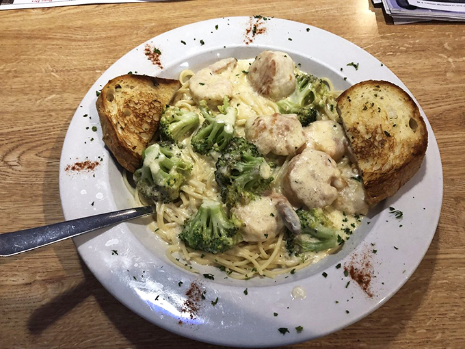 Pasta embracing broccoli and seafood in a creamy sauce&mdash;a coastal comfort dish that makes you wonder why you'd ever need fancy dining.