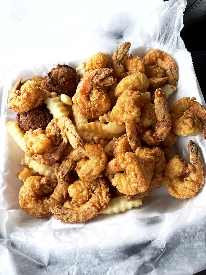 A basket of golden fried shrimp that makes you seriously consider moving closer to the ocean. Permanently.