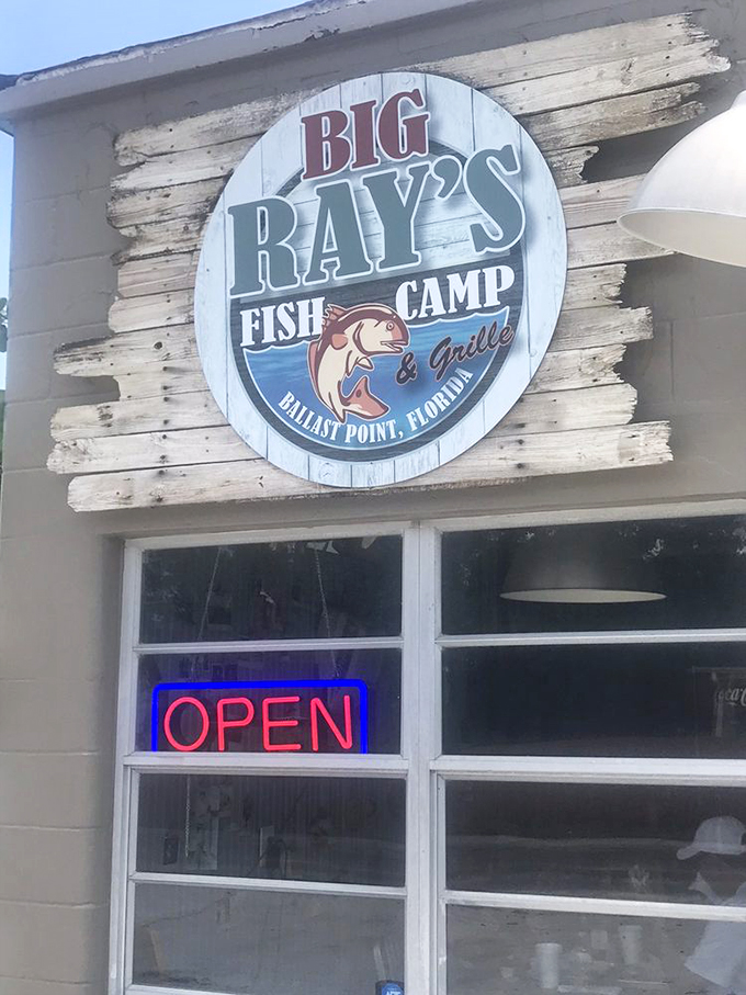 The weathered sign says it all: authentic Florida seafood awaits. No neon required when your reputation shines this brightly.
