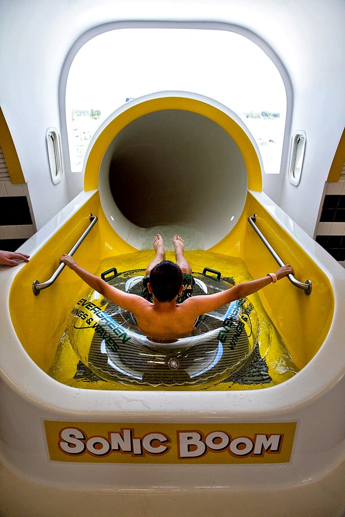 The yellow slide entrance: where courage is tested and physics is about to become very, very personal. Hold onto those handrails, folks!