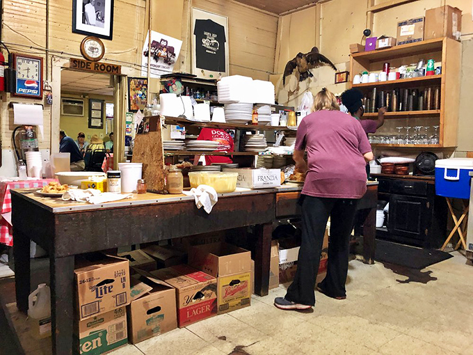 Behind every legendary meal is someone who knows exactly what they're doing. The kitchen staff moves with the confidence of culinary artists. 