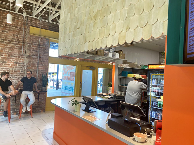 The open kitchen layout means you can watch your chicken journey from raw to remarkable while chatting with the friendly staff.