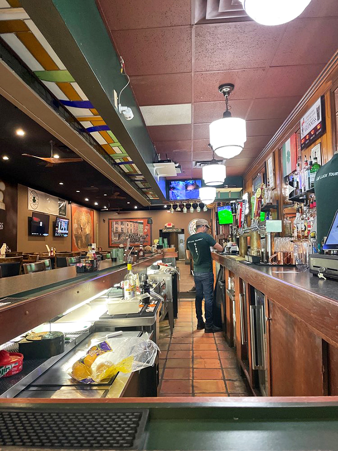 The bar area, where pints are poured with reverence and the stained glass overhead adds that touch of old-world charm to your drinking experience.