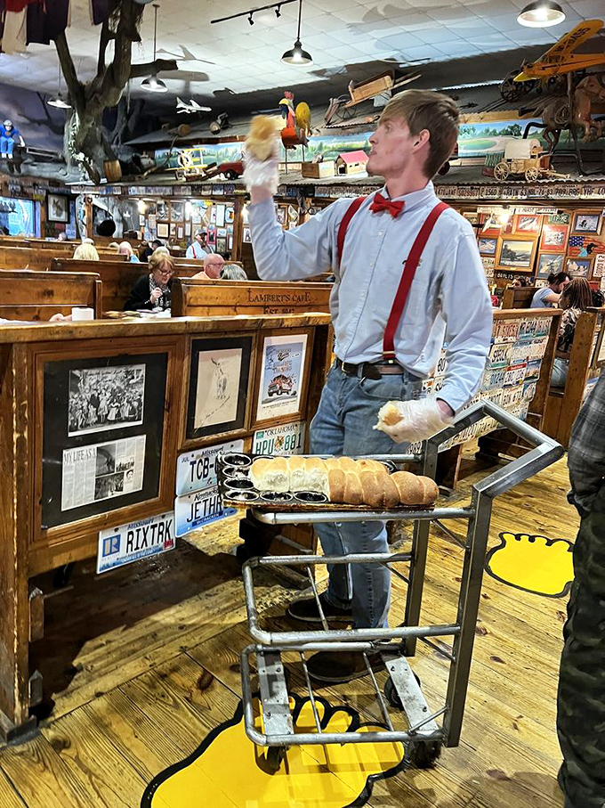 The roll thrower prepares for his moment of glory. Part athlete, part server, all showman&mdash;with a tray of carb ammunition ready for launch.