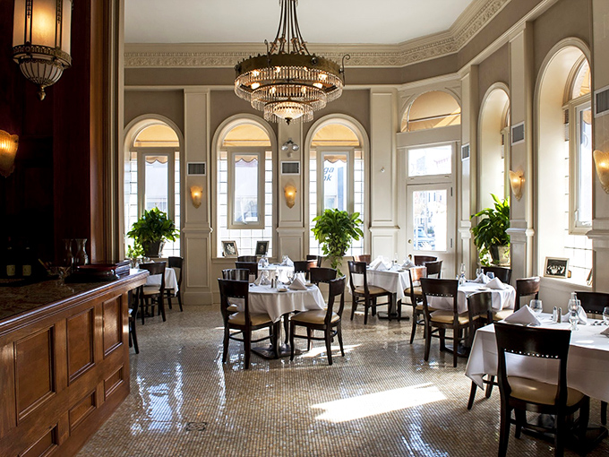 Sunlight streams through tall windows, blessing each table with golden warmth. A dining room that understands the importance of atmosphere.