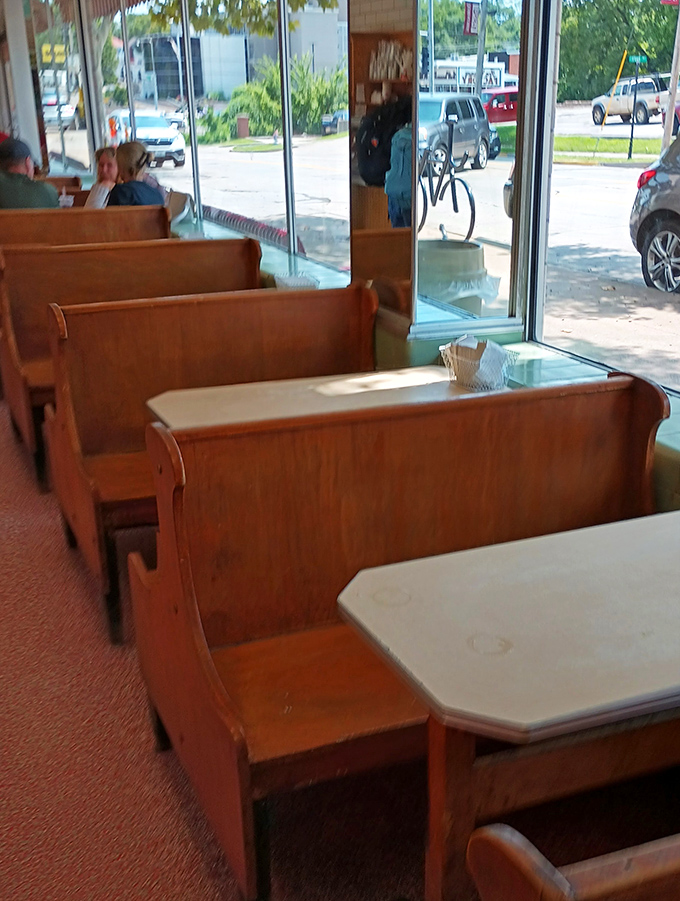 These wooden booths have absorbed decades of conversations, first dates, and the silent appreciation that follows that first perfect bite.