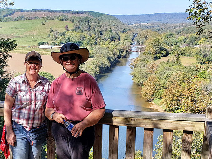 Happy hikers pause to capture the view, proving that some vistas are worth the uphill battle and inevitable "are we there yet?" questions.