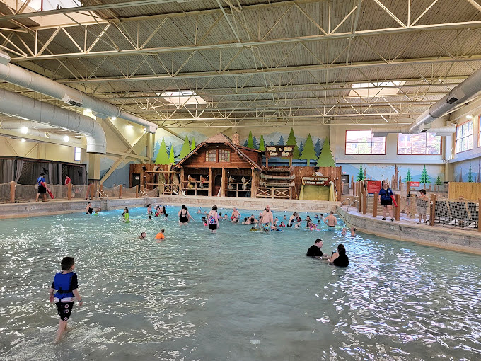 The wave pool transforms from peaceful lagoon to rollicking sea with the sound of a horn, sending ripples of excitement through swimmers of all ages.