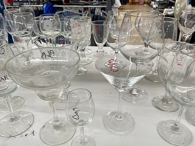 Crystal stemware catches the fluorescent light like diamonds. Someone's wedding registry rejects become your sophisticated cocktail party collection.