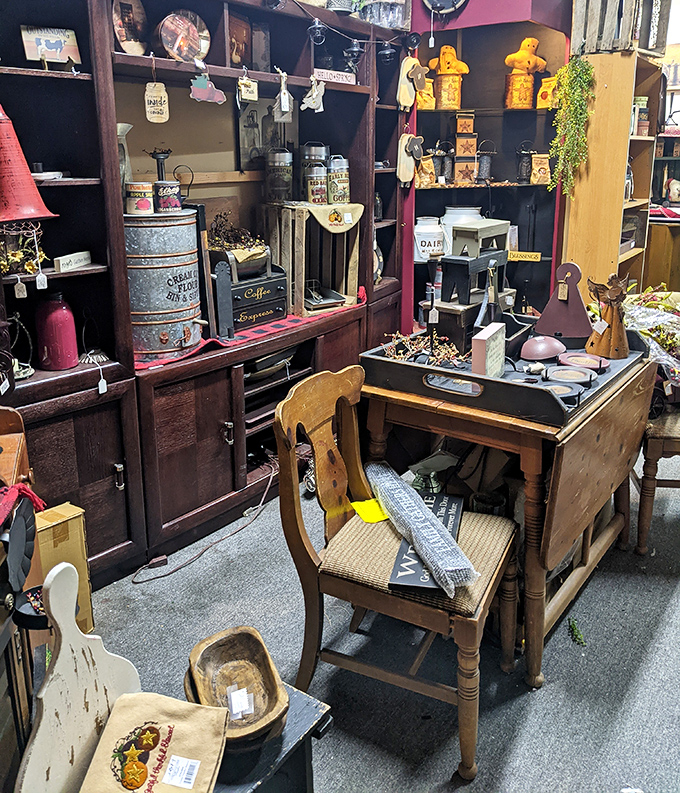This carefully arranged desk vignette feels like stepping into a 1940s office, complete with vintage coffee tins and farm implements that tell stories of work past.
