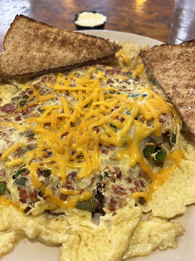This western scrambler isn't just breakfast&mdash;it's a sunrise on a plate. Melted cheddar cascades over ham and veggies like morning light through kitchen windows.