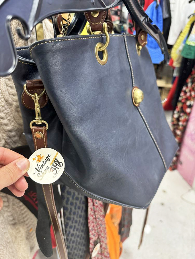 The Vintage Shop tag dangles from a leather purse that's seen more of the world than most passports. Quality never goes out of style.