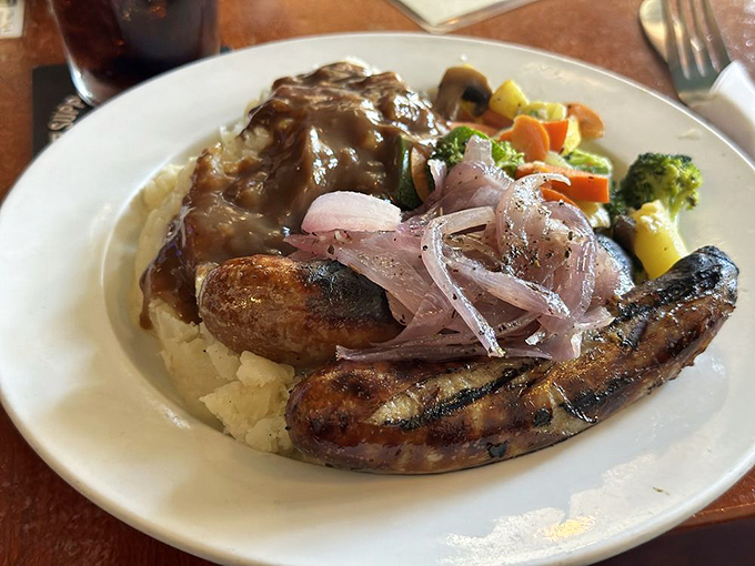 Bangers and mash: where sausages lounge on a cloud of potatoes with a gravy hot tub and vegetable garnish. Comfort food nirvana.