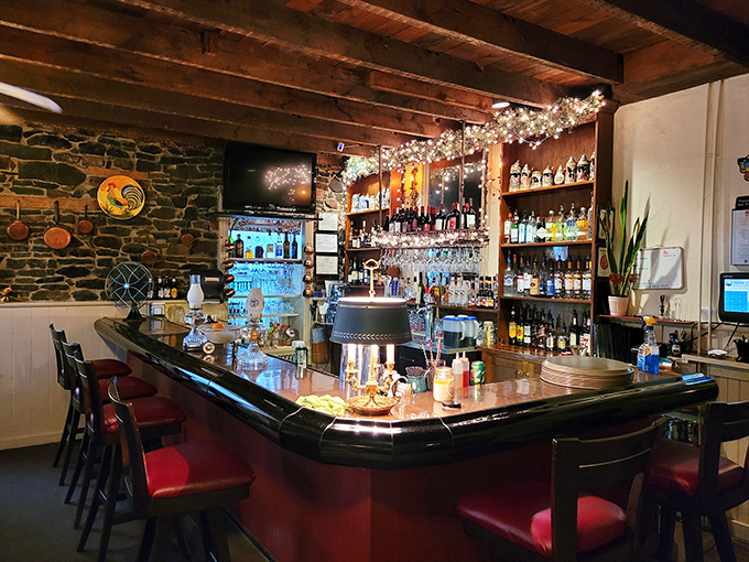The bar area combines rustic charm with sophisticated offerings, where stone walls have likely witnessed countless toasts to special occasions. 