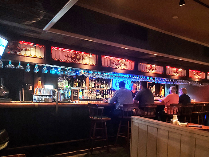 A bar that says "pull up a stool and stay awhile." Those stained-glass accents have witnessed countless celebration toasts.