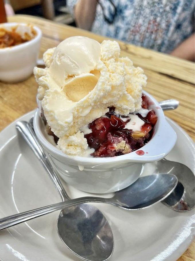 Berry cobbler that makes you understand why people write songs about dessert. That scoop of vanilla ice cream is melting with excitement.