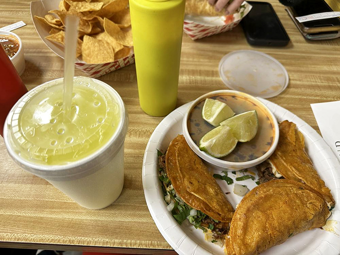 Golden-fried tacos dorados looking like they just won first place at the Olympics of crunch. That green salsa is their victory speech.