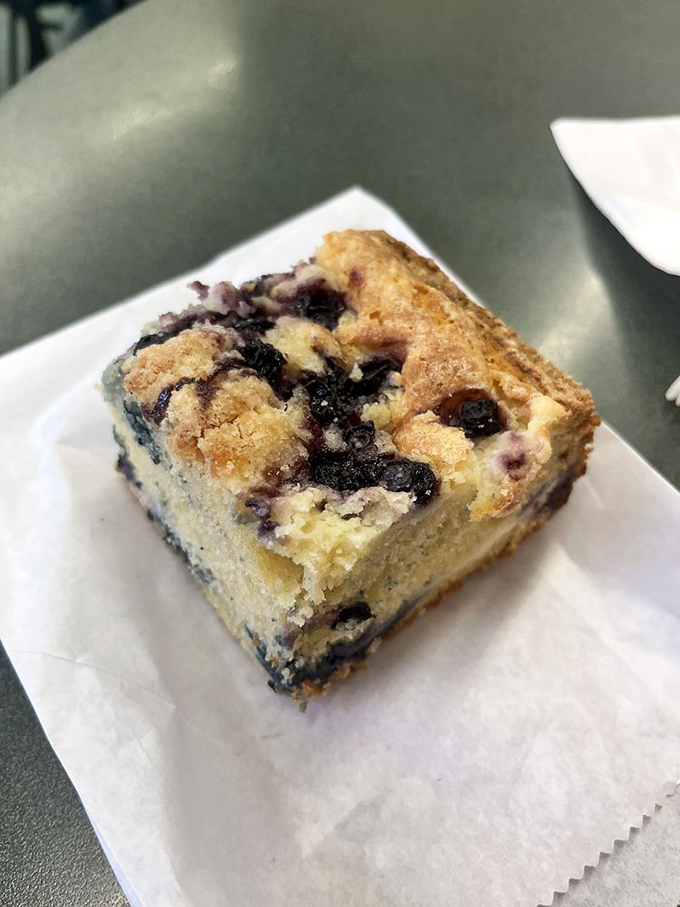 This blueberry cream cheese cake isn't just dessert; it's therapy you can eat with a fork. The crumble top adds texture that should be illegal. 