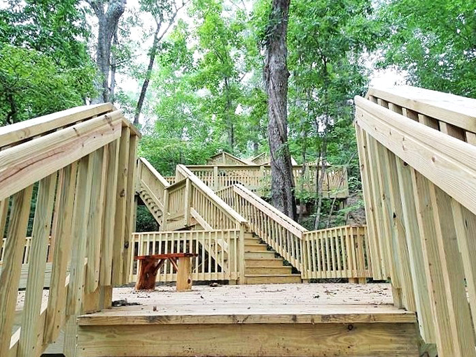 These wooden steps at Boone's Cave Park lead adventurers into nature's embrace, the perfect digestive walk after a barbecue feast.