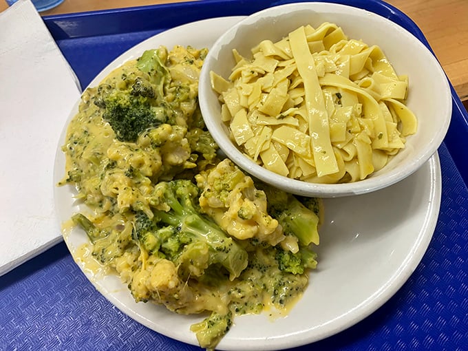 Broccoli and cheese having their perfect romance while buttered noodles wait patiently on the side&mdash;a plate of Midwestern poetry.
