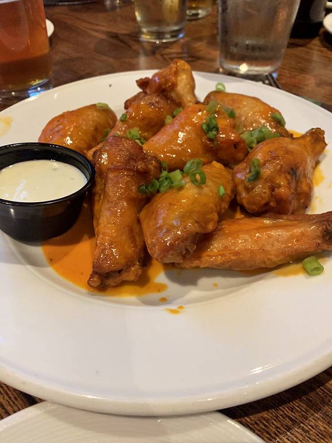 These aren't just wings&mdash;they're flavor bombs, glistening with sauce and garnished with green onions that add both color and a hint of sharpness.