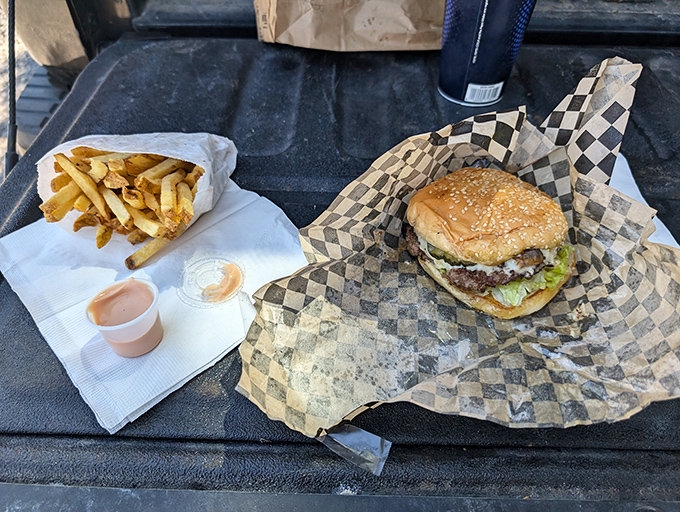 This isn't just a burger and fries&mdash;it's edible architecture, a masterpiece of beef, cheese, and golden potatoes.