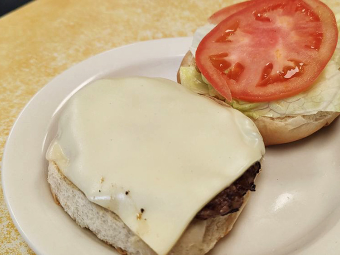Cheese melted to perfection atop a hand-pressed patty&mdash;proof that Abe's isn't just a one-trick pony in the comfort food rodeo. 