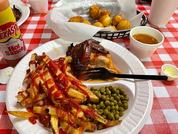 French fries drizzled with ketchup, garden peas, and barbecued chicken&mdash;comfort that transcends age, income, and culinary pretension.