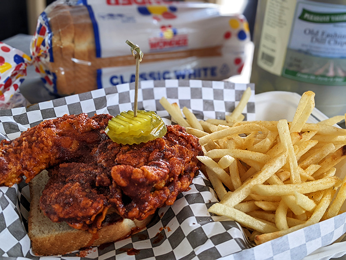 The hot chicken sandwich: where a perfectly fried thigh meets pickle, bun, and enough spice to make your ancestors feel the burn. 