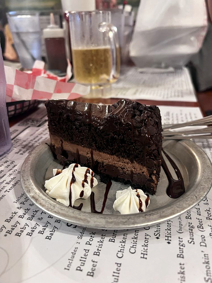 A slice of chocolate cake so rich and decadent it should come with its own tax bracket and financial advisor.