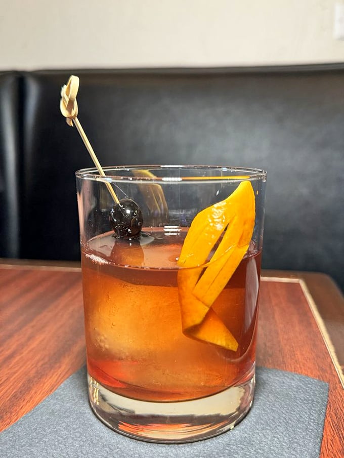 A classic cocktail garnished with orange and cherry&mdash;the liquid equivalent of Frank Sinatra's perfectly tailored suit. Timeless and sophisticated.