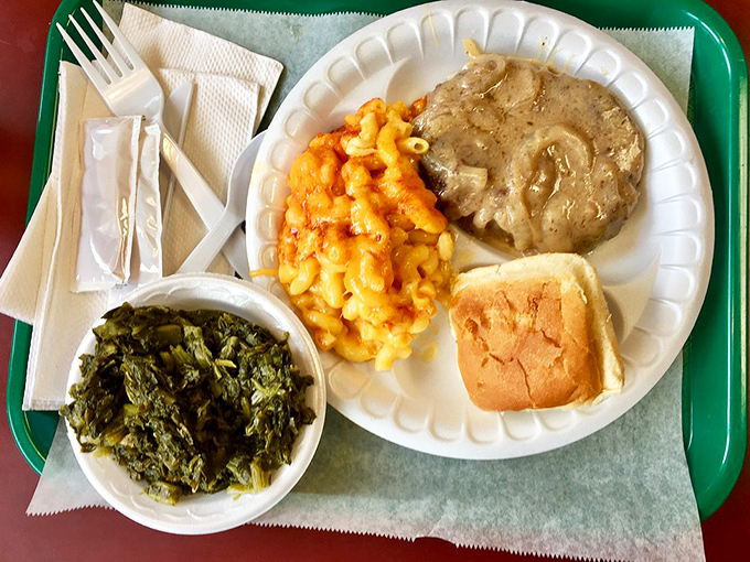 Country-style steak swimming in gravy alongside mac and cheese that gleams like liquid gold&mdash;comfort food that speaks a universal language.