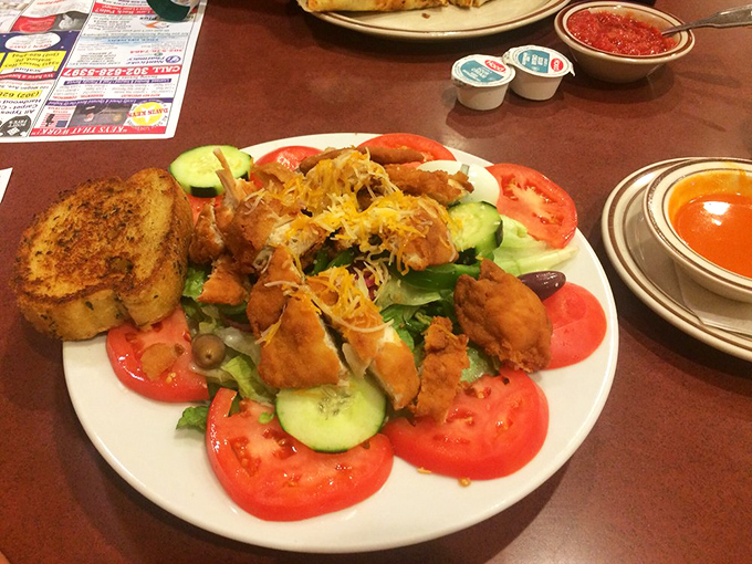 Buffalo chicken salad that solves the eternal dilemma: "I should eat healthy, but I want something fried." The best of both worlds on one plate.