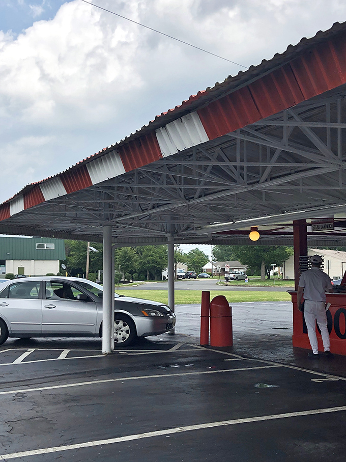The timeless ritual of curbside service. Turn your lights on, and like magic, dinner appears at your window&mdash;no app required, just good old-fashioned human connection.