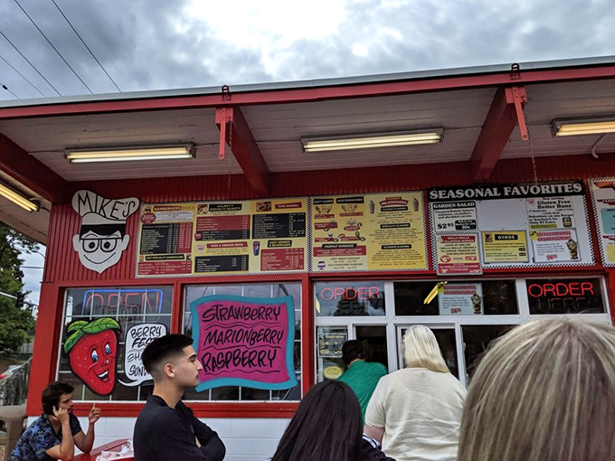 The ordering window at Mike's&mdash;where dreams come true and diet plans go to die. Worth every minute in line. 