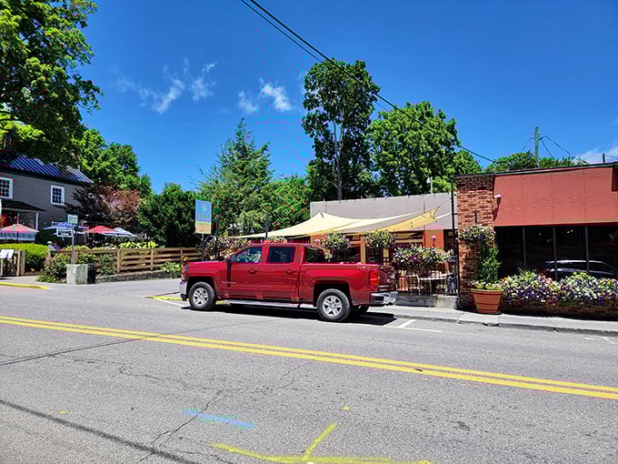 Del Sol's outdoor seating area bursts with colorful flowers, creating an oasis where food and nature complement each other perfectly.