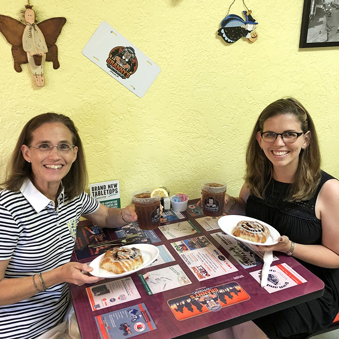 The yellow walls and smiling patrons tell the real story &ndash; this isn't just about the food, it's about the joy of sharing it.